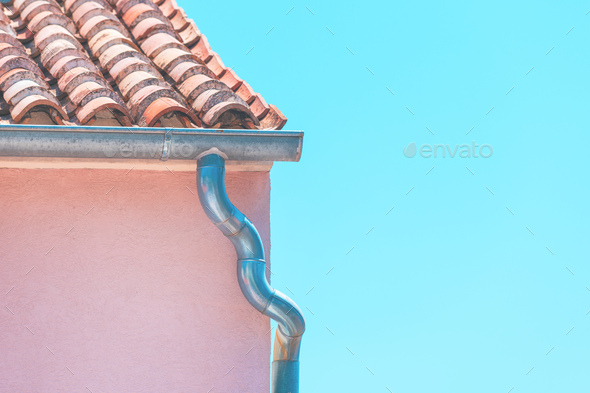 Rain gutter on rustic mediterranean house Stock Photo by stevanovicigor