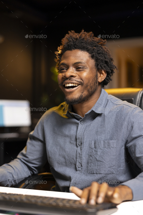 Delighted gamer laughing after finally defeating all enemies while ...