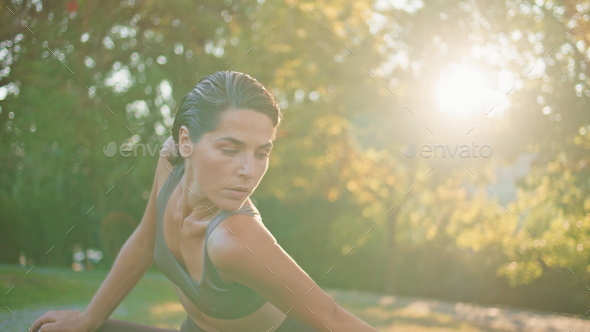 Flexible lady bending body at sun park closeup. Sportswoman stretching ...