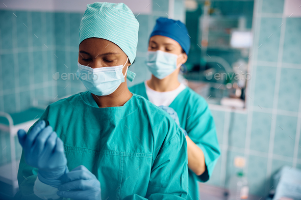 Black female surgeon getting ready for the operating room. Stock Photo ...