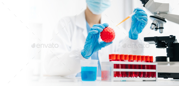 female scientist working with micro pipettes analyzing biochemical ...