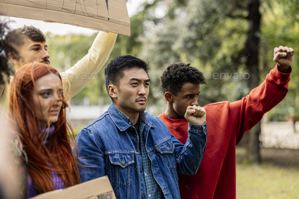 portrait of group of multiracial young people fighting for equality and ...