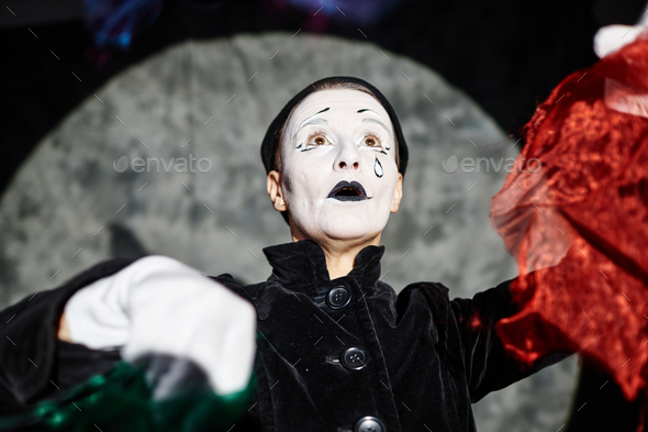 Mime Performing on Stage with Props Stock Photo by seventyfourimages