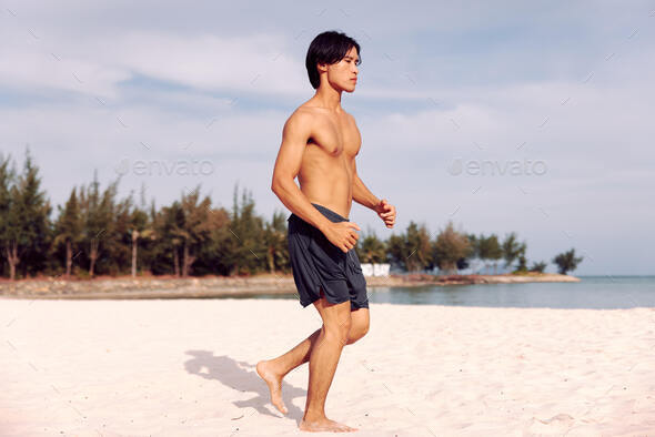 Smiling Asian Man Enjoying Tropical Beach Vacation with Muscular Torso ...