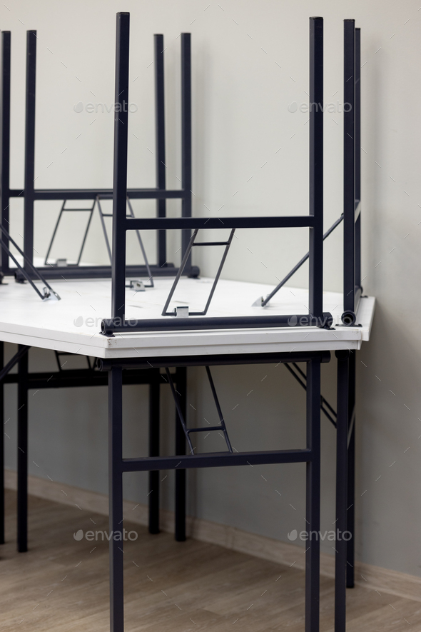 Tables turned upside down on tables in the room Stock Photo by ...