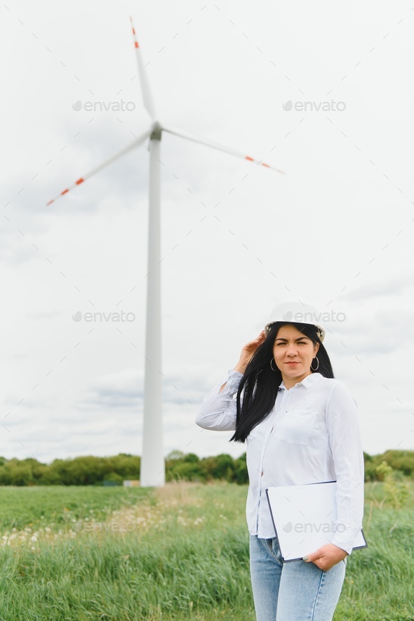 Female Engineer in a Wind Turbines Farm Stock Photo by sedrik2007 ...