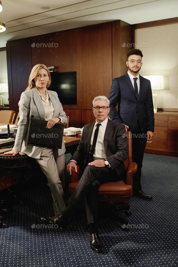 Male and Female Attorneys Posing for Group Portrait at Their Workplace ...