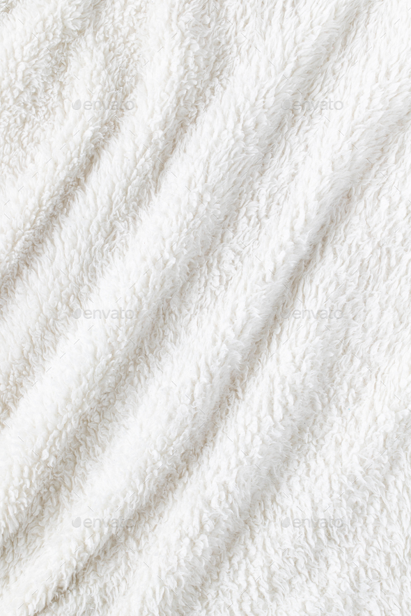White plush fabric of cozy throw. Warm blanket background Stock Photo ...