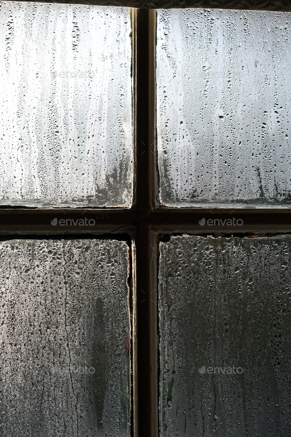 Old vintage medieval window view, with wooden frame, glass covered with ...