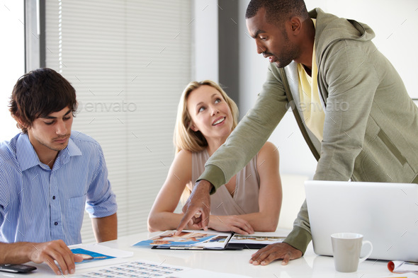 Three creatives brainstorming together Stock Photo by ...