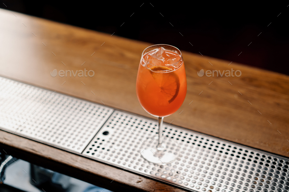 Delicious Aperol spritz cocktail standing on bar counter in restaurant ...