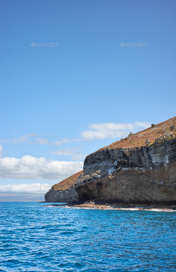 Cliff of an uninhabited island seen from the water, Galapagos National ...