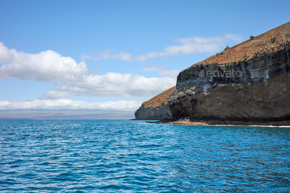 Cliff of an uninhabited island seen from the water, Galapagos National ...