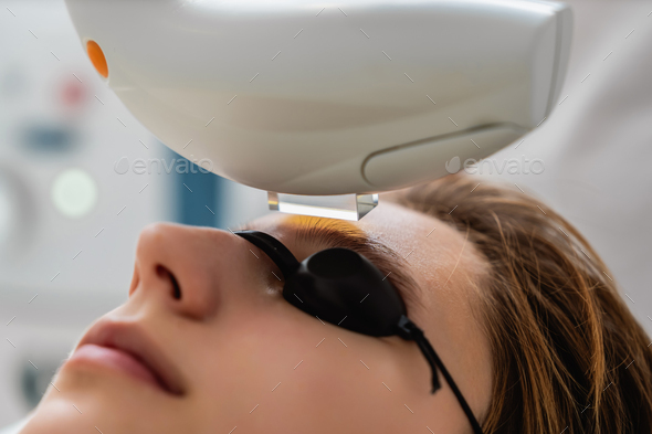 Phototherapy, photorejuvenation, IPL in a beauty salon. Care for a ...