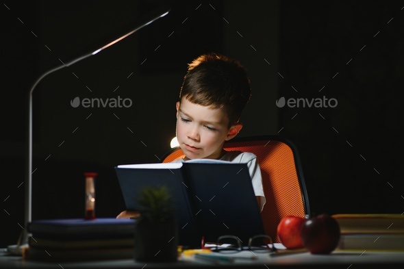 boy doing homework at home in evening Stock Photo by sedrik2007 | PhotoDune