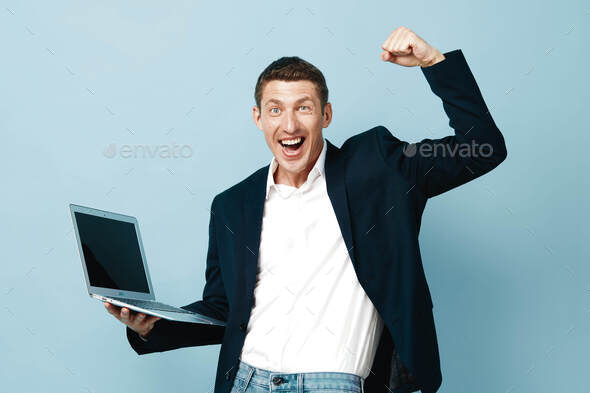 Victory man excited notebook manager winner gesture win workplace ...