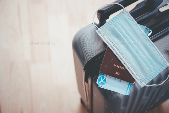 Passport and mask On luggage, concept tourism planning and new normal ...