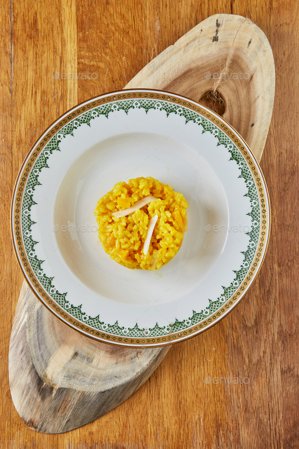 Risotto, ready-made portion of step-by-step recipe in a vintage plate ...