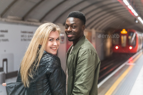Happy multiracial couple in love in London Stock Photo by williamperugini