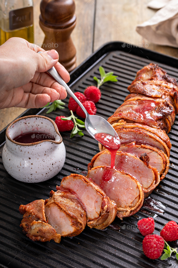 Pork tenderloin wrapped in bacon with raspberry vinaigrette Stock Photo ...