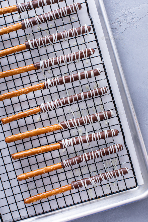 Chocolate covered pretzel rods freshly made on a cooling rack Stock ...