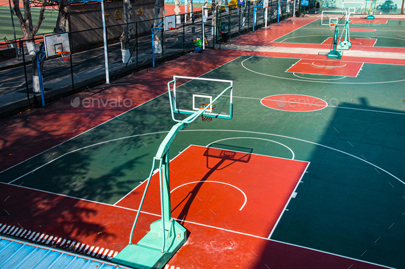 Open college basketball court, with bright colors, illuminated by the ...