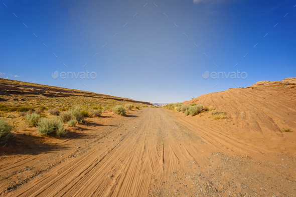 Scenic desert landscape with a dirt road in Arizona Stock Photo by ...