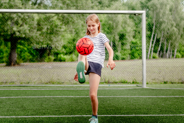 Pretty child girl with football ball Stock Photo by tan4ikk | PhotoDune
