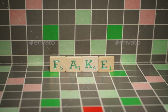 Tile with green fake text on a blocked background Stock Photo by wirestock
