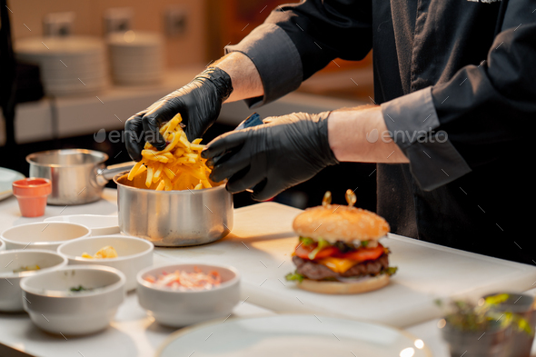 kitchen in the restaurant of the hotel, the chef makes a beautiful ...