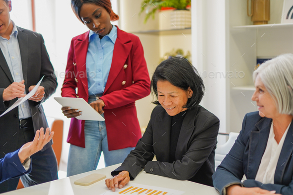 Multi generational business people working inside modern office Stock ...