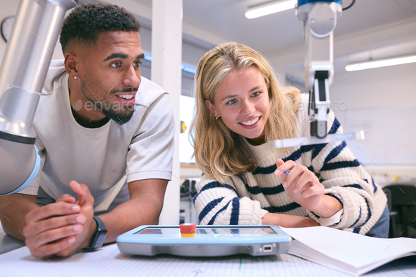 Male And Female College Or University Engineering Students In Robotics ...