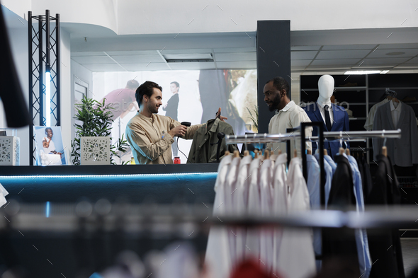 Customer at clothing store counter Stock Photo by DC_Studio | PhotoDune