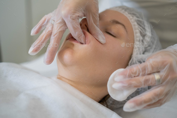 Skilled hands deliver a buccal massage, targeting inner cheek muscles ...