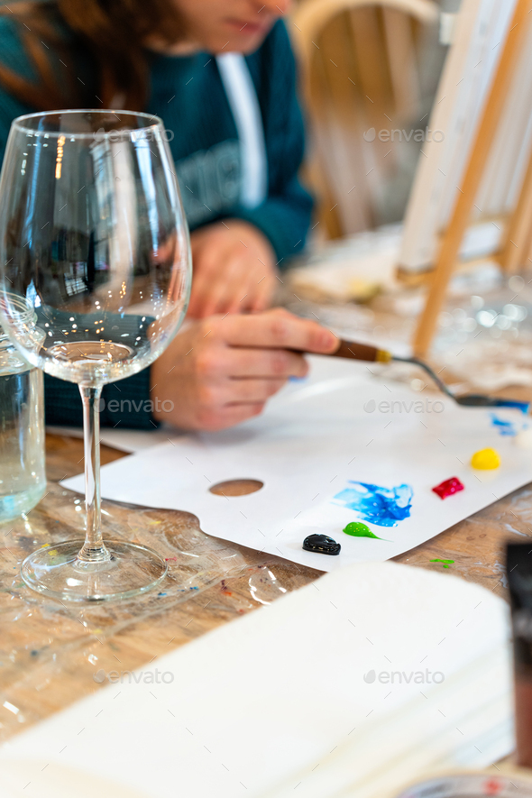 Sip and Paint Event. Mixing colors. Empty wine glass. Stock Photo by ...