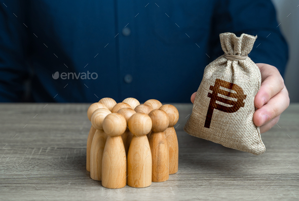 Man adjusts an philippine peso money bag to a crowd of people figurines ...