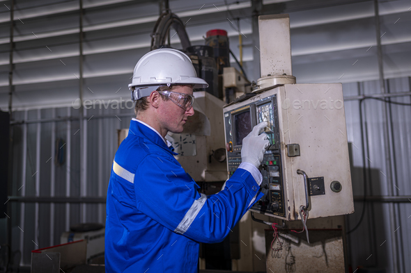 Industry engineer worker wearing safety uniform control operating ...