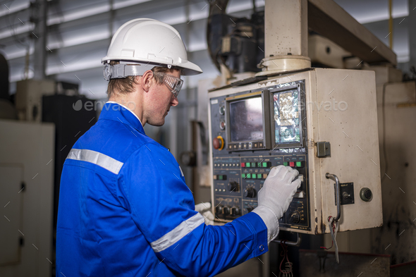 Industry engineer worker wearing safety uniform control operating ...