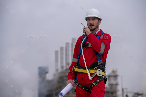 Engineer survey team wear uniform and helmet stand workplace checking ...