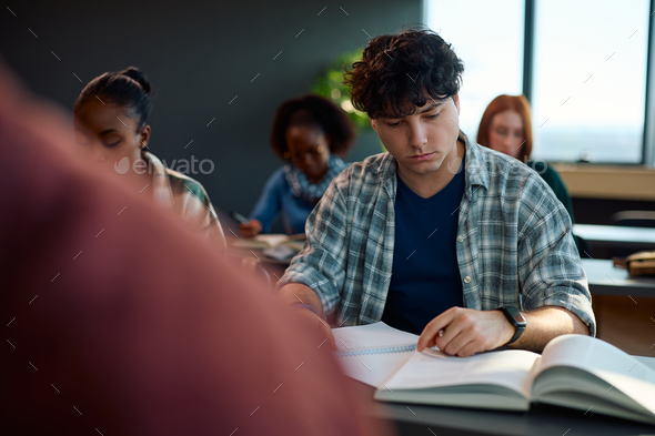 College student learning while attending a lecture in the classroom ...