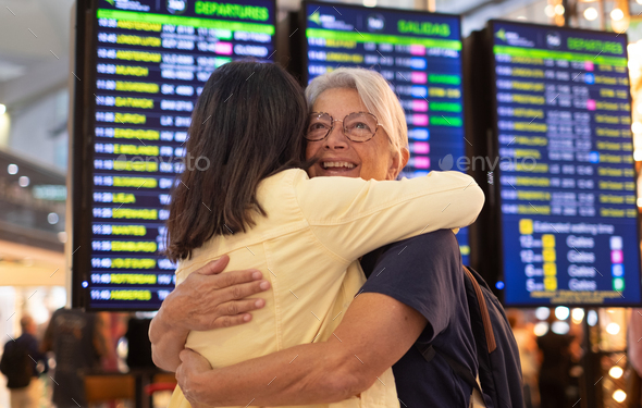 Airport terminal reunion. Travel, friends, family hug in airport ...