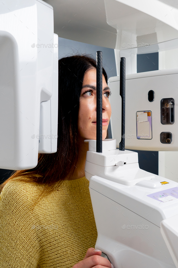 portrait of a beautiful woman doing a 3D scan of the nose and oral ...