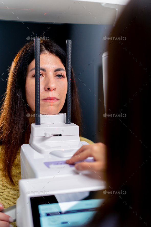 portrait of a beautiful woman doing a 3D scan of the nose and oral ...