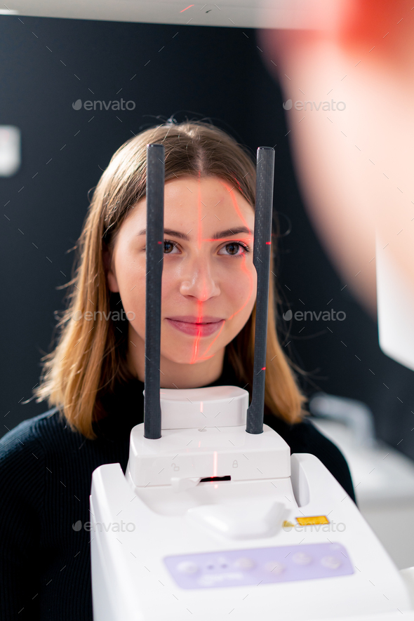 portrait of a beautiful woman doing a 3D scan of the nose and oral ...