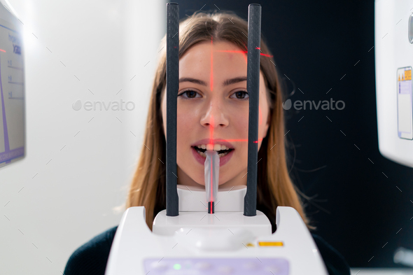 portrait of a beautiful woman doing a 3D scan of the nose and oral ...