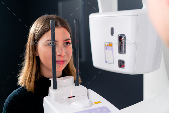 portrait of a beautiful woman doing a 3D scan of the nose and oral ...