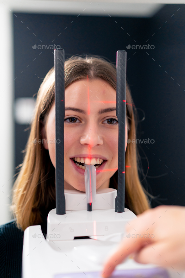portrait of a beautiful woman doing a 3D scan of the nose and oral ...