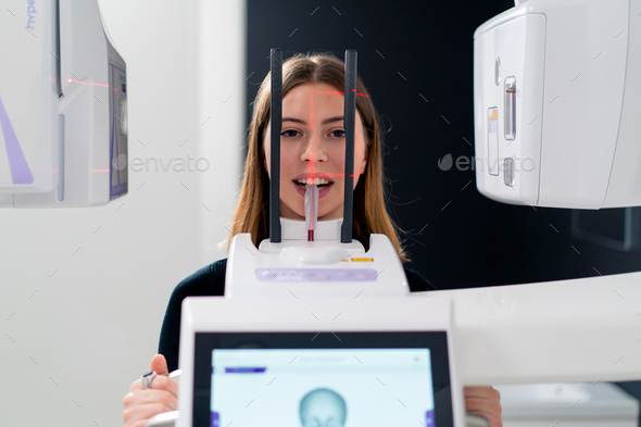 portrait of a beautiful woman doing a 3D scan of the nose and oral ...