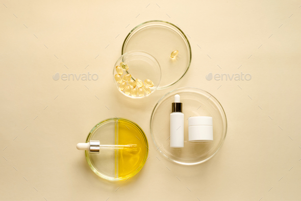 Skincare Cosmetics and Petri dishes with essence, serum, capsules Stock ...