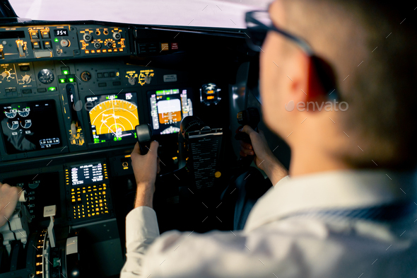 an airplane cockpit Center panel with main flight display navigation ...